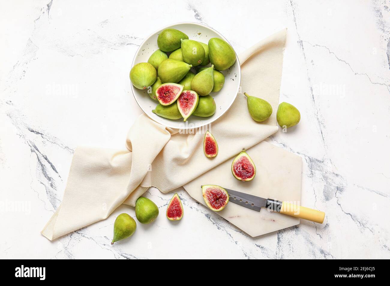 Fresh green figs on light background Stock Photo - Alamy