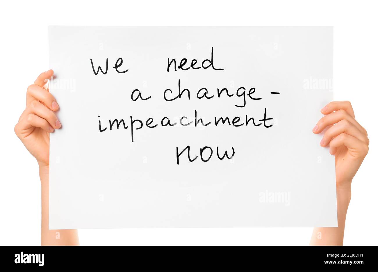 Hands holding paper with text WE NEED A CHANGE - IMPEACHMENT NOW on ...