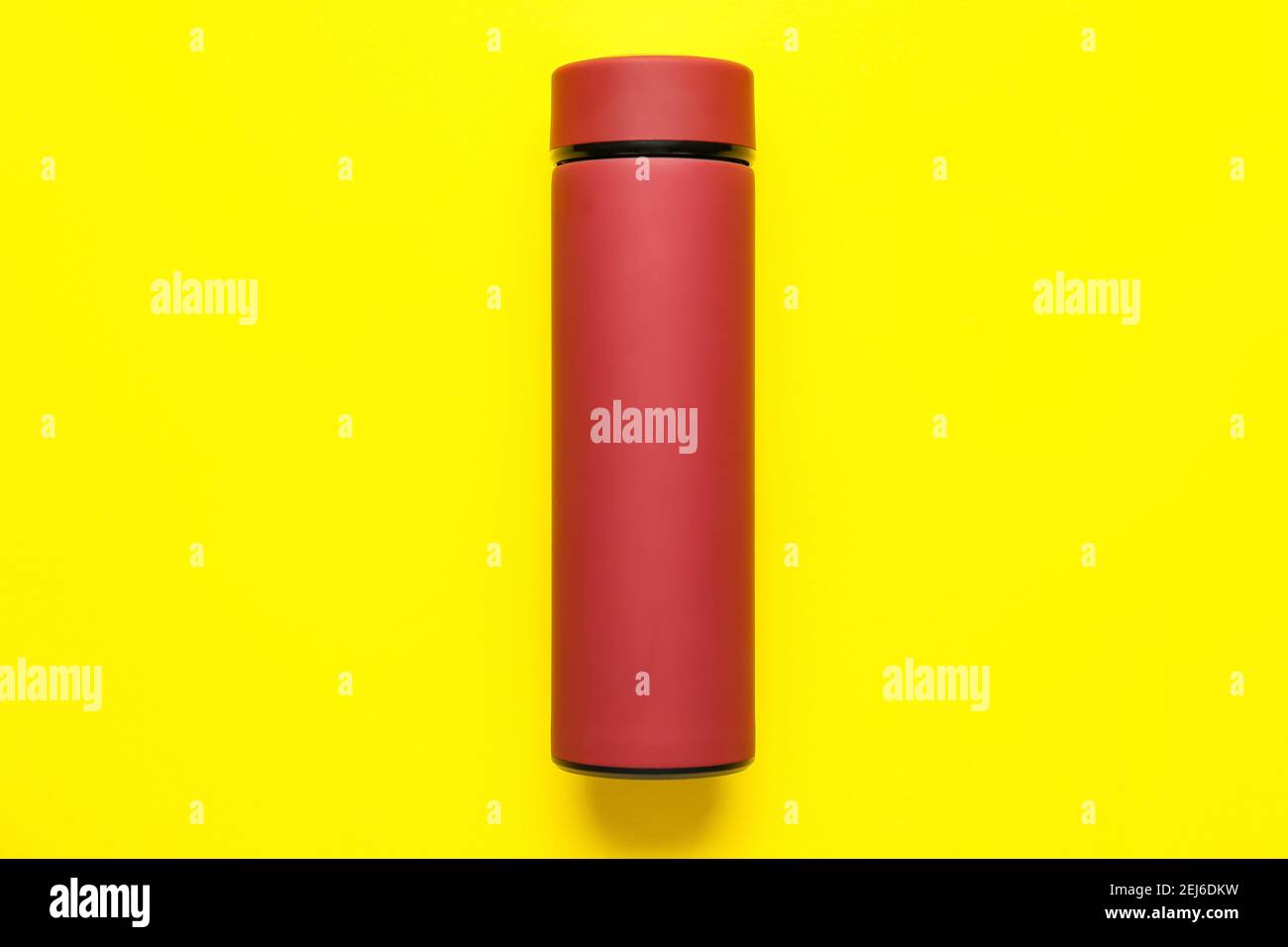 Modern thermos on color background Stock Photo - Alamy