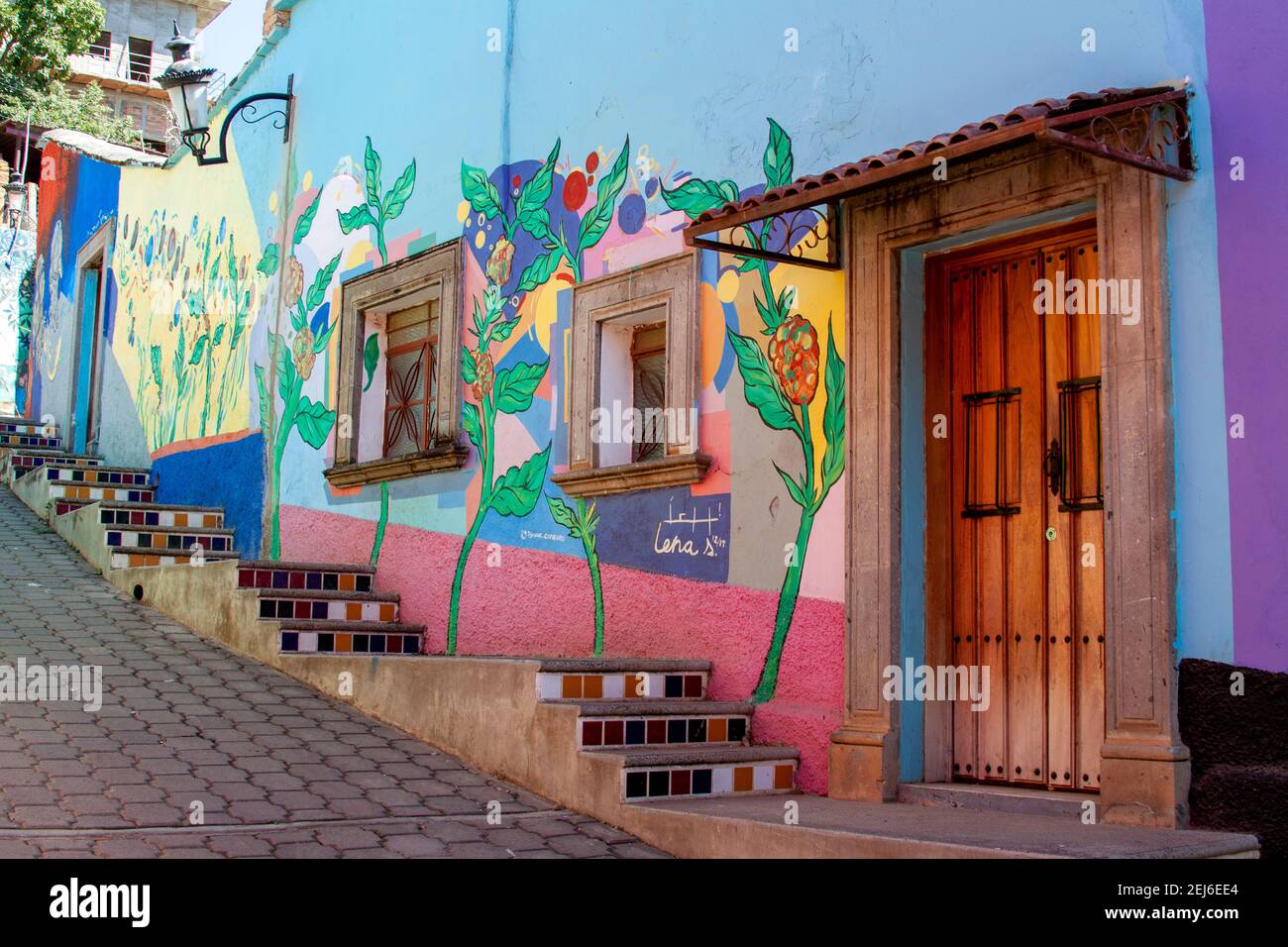 A colorful wall on an alley in a Mexican town Stock Photo - Alamy
