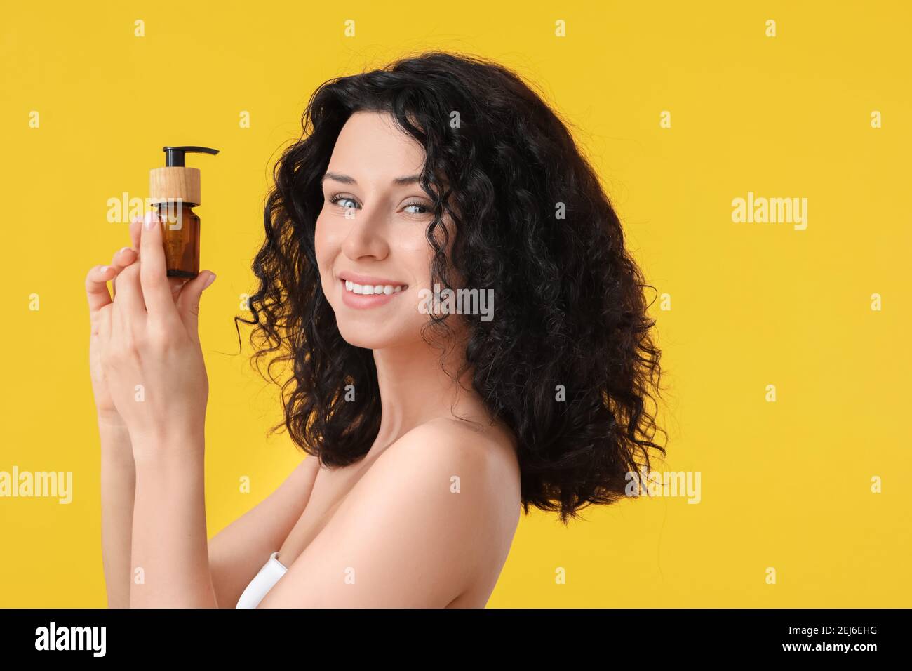 Beautiful young woman with cosmetic product on color background Stock ...