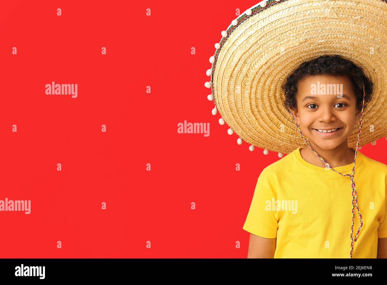 Funny Mexican boy in sombrero hat on color background Stock Photo - Alamy