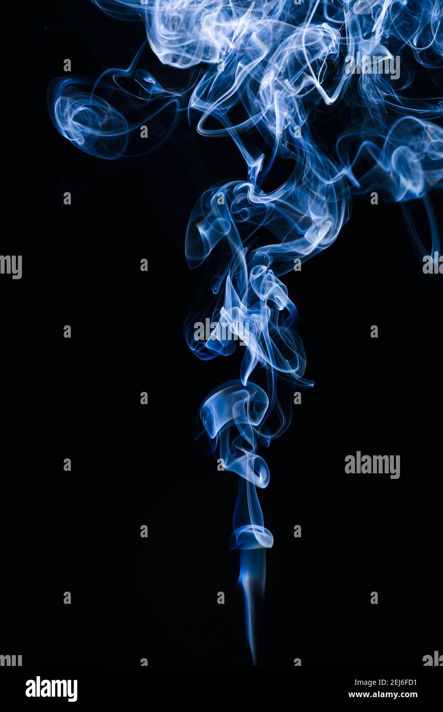 Cigarette smoke on dark background Stock Photo - Alamy
