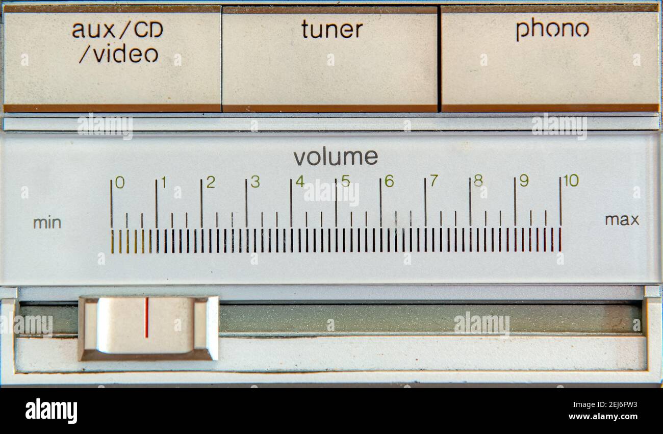 closeup of some of the controls on an old stereo system. Volume slider ...