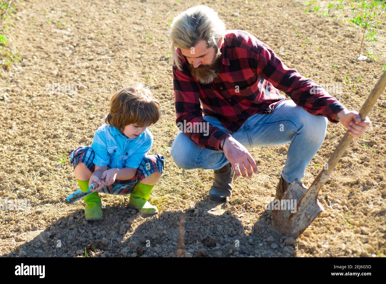 Father teach son plant hi-res stock photography and images - Alamy