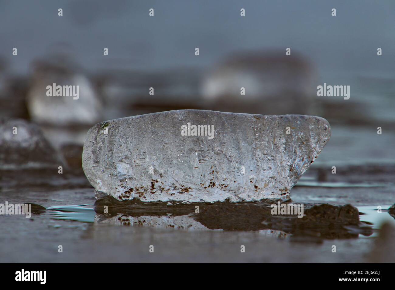 Side view of ice block laying on ice surface, selective focus Stock ...