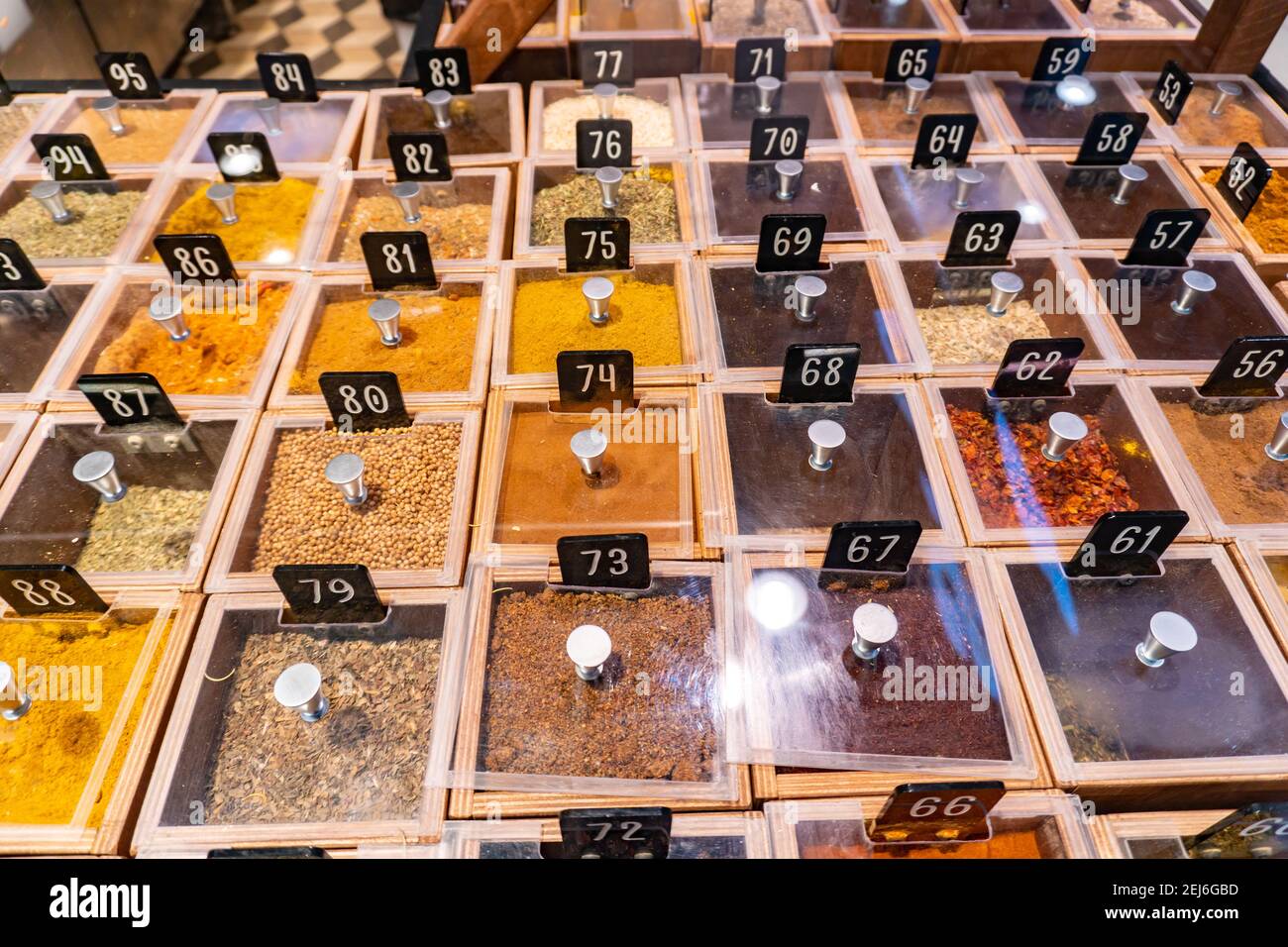 Various condiments with showcases of supermarket. Colorful spices and ...