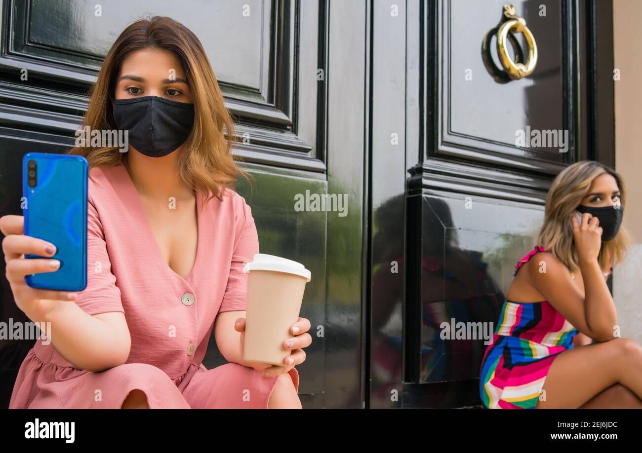 Two people keeping distance outdoors Stock Photo - Alamy