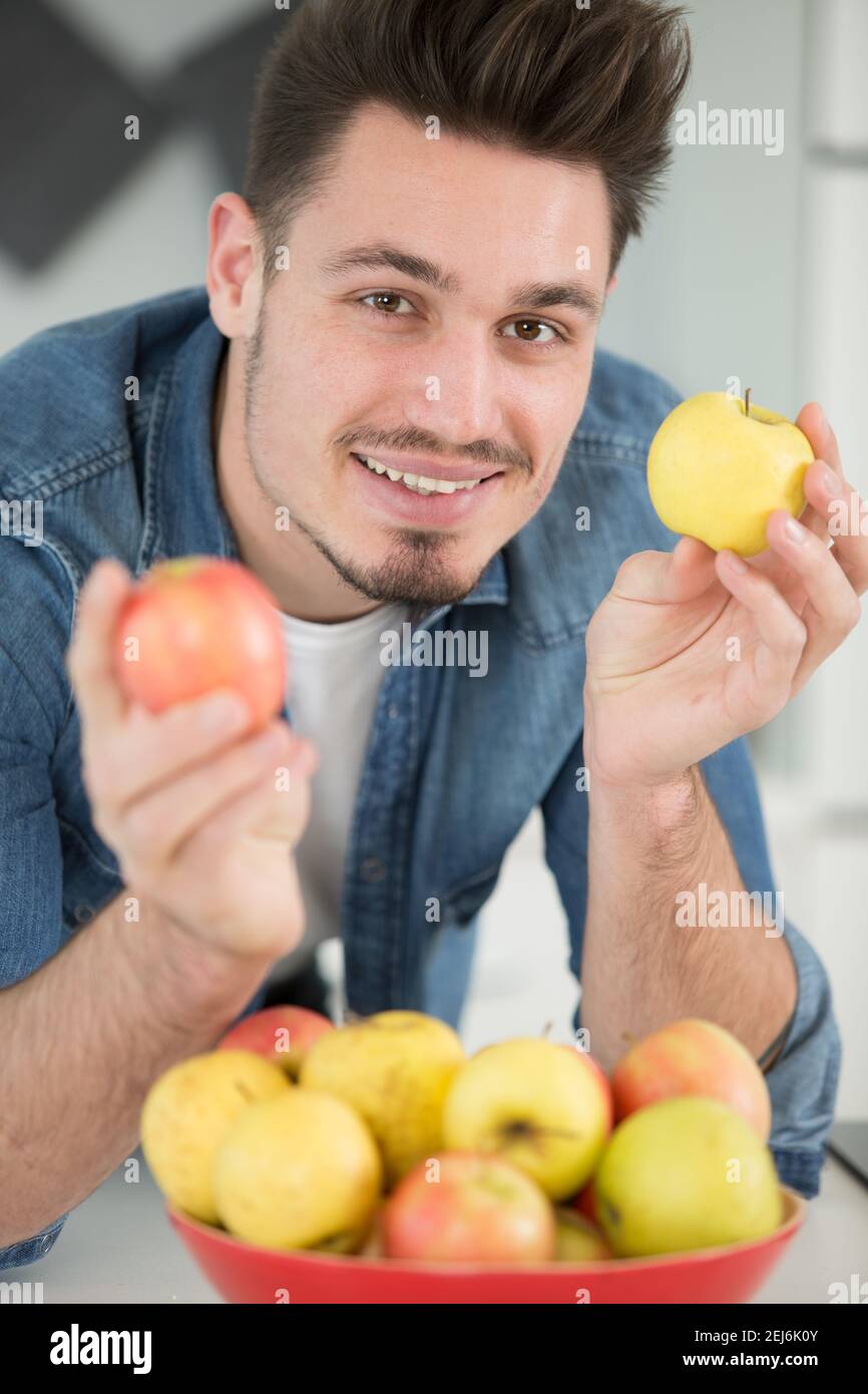Happy man giving bowl hi-res stock photography and images - Alamy