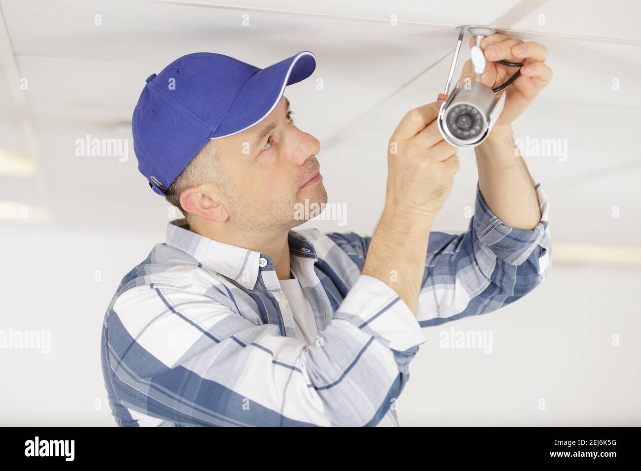 professional cctv technician installing camera Stock Photo - Alamy