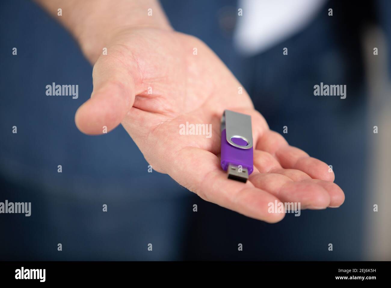 flash drive in hand isolated Stock Photo - Alamy