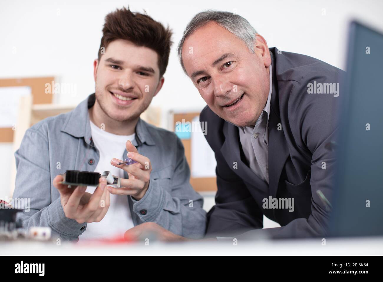 young electronics student with his teacher Stock Photo - Alamy