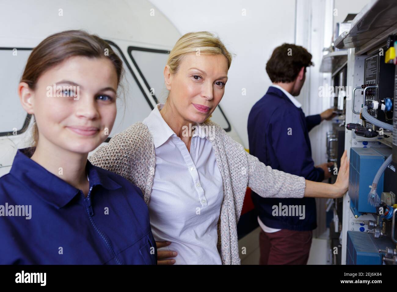 two beautiful female colleagues working on project Stock Photo - Alamy