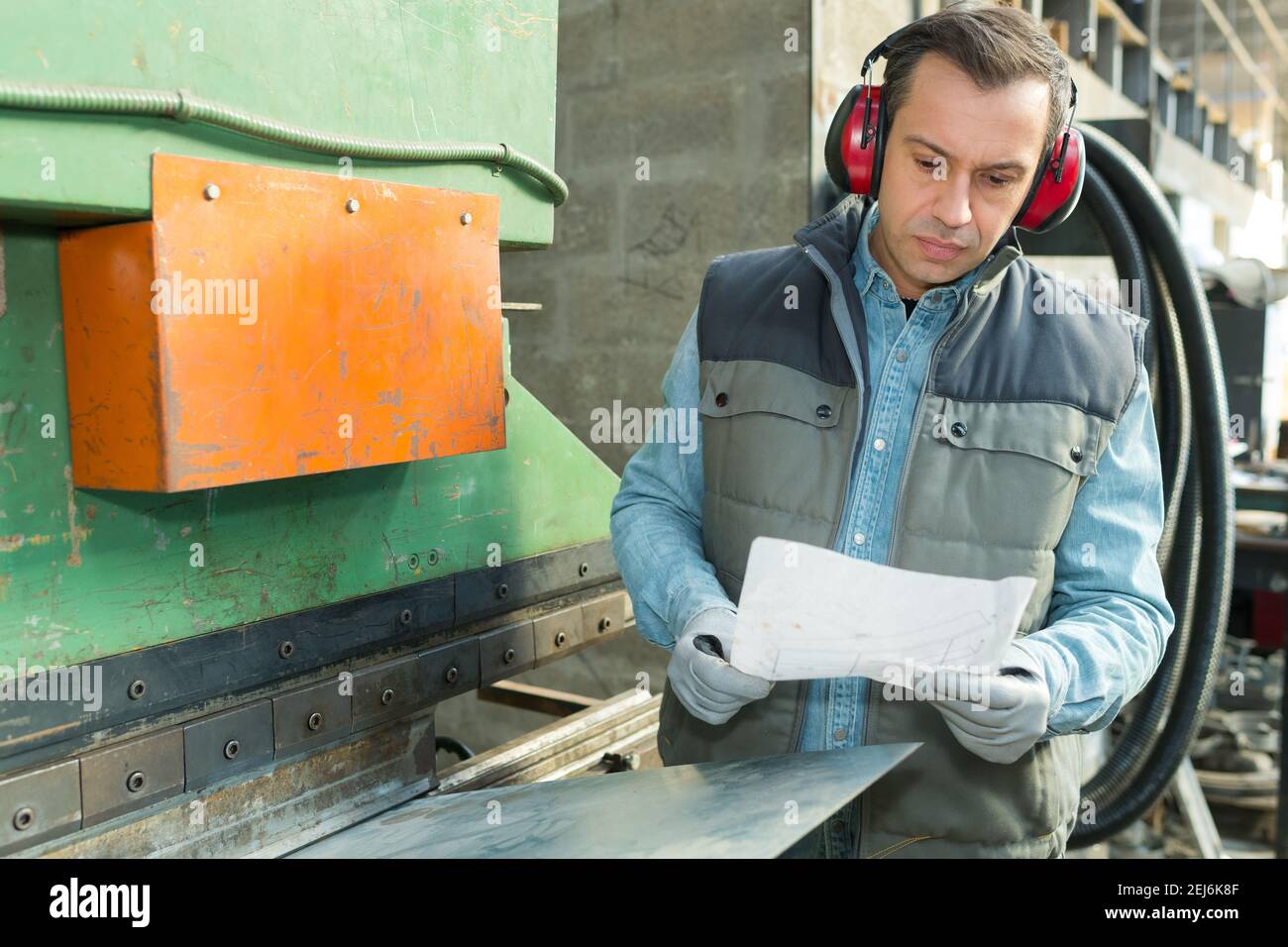 happy industry worker working in plant Stock Photo - Alamy