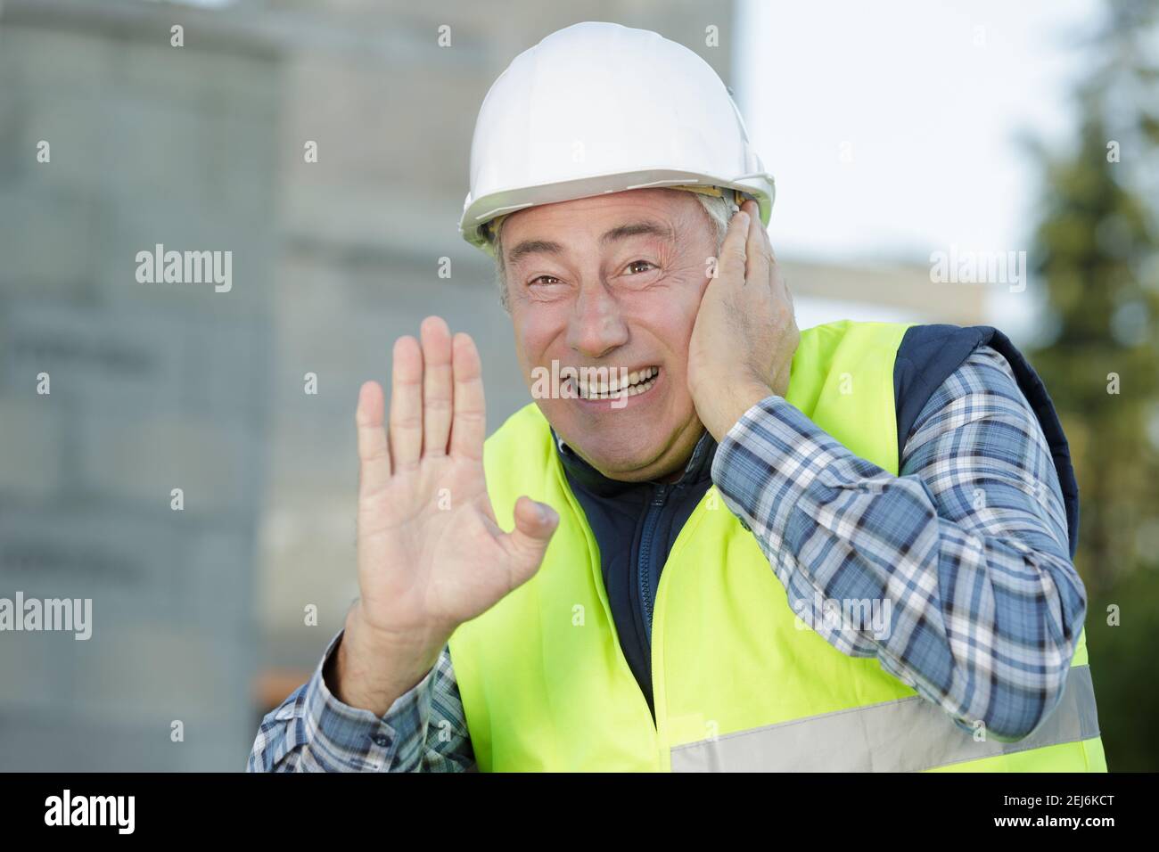 a deafened engineer with helmet Stock Photo - Alamy