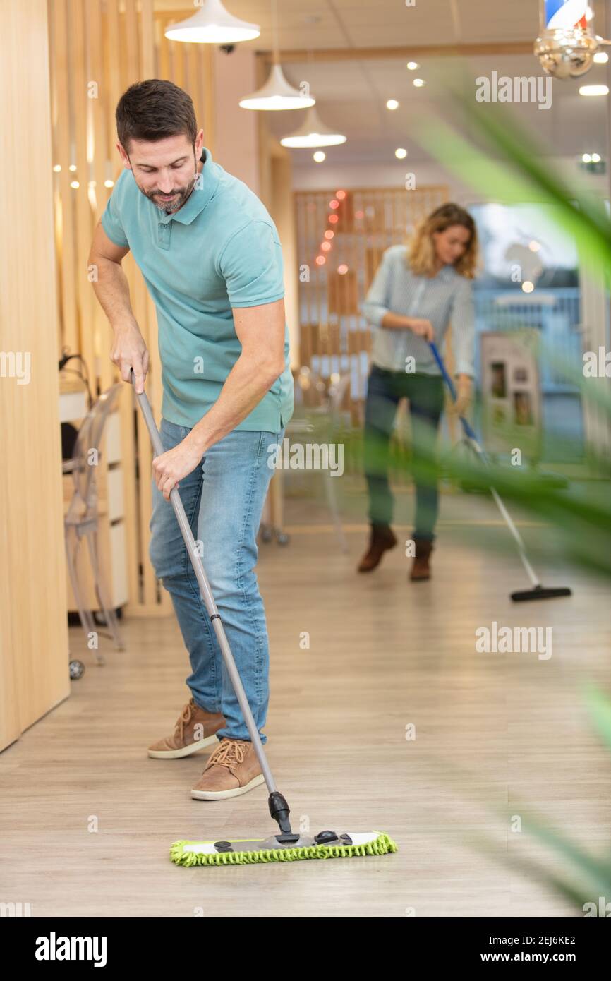 Barber cleaning floor hairdresser salon hi-res stock photography and ...