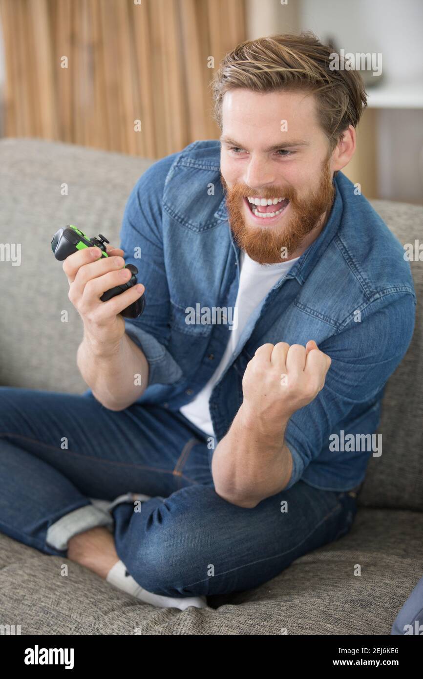happy video gamer addicted man Stock Photo - Alamy