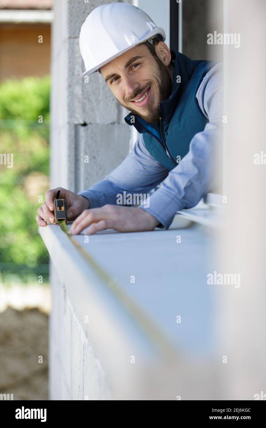 male builder during reconstruction of a house Stock Photo - Alamy