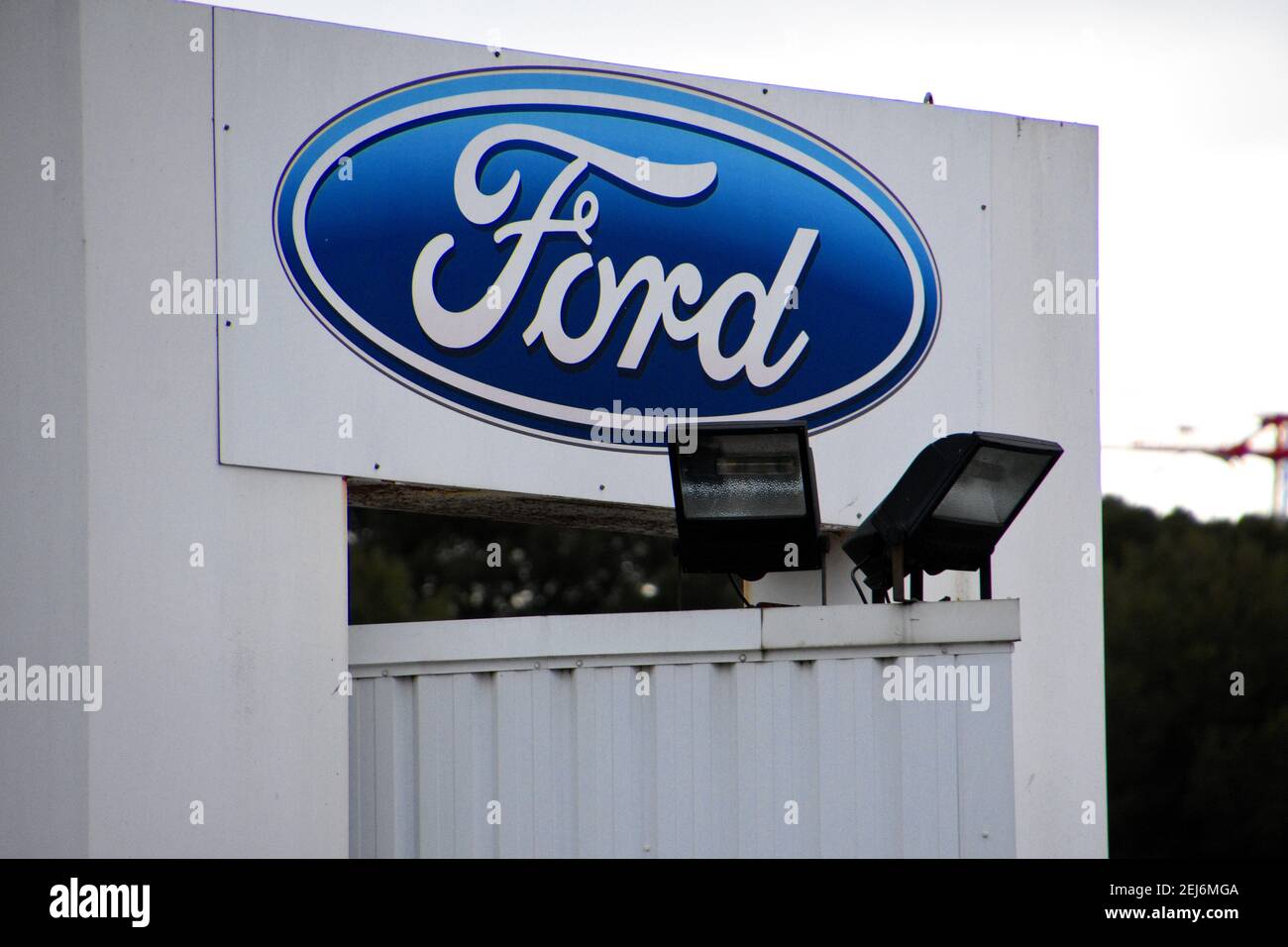 Ford company logo seen on one of their car dealerships showrooms ...