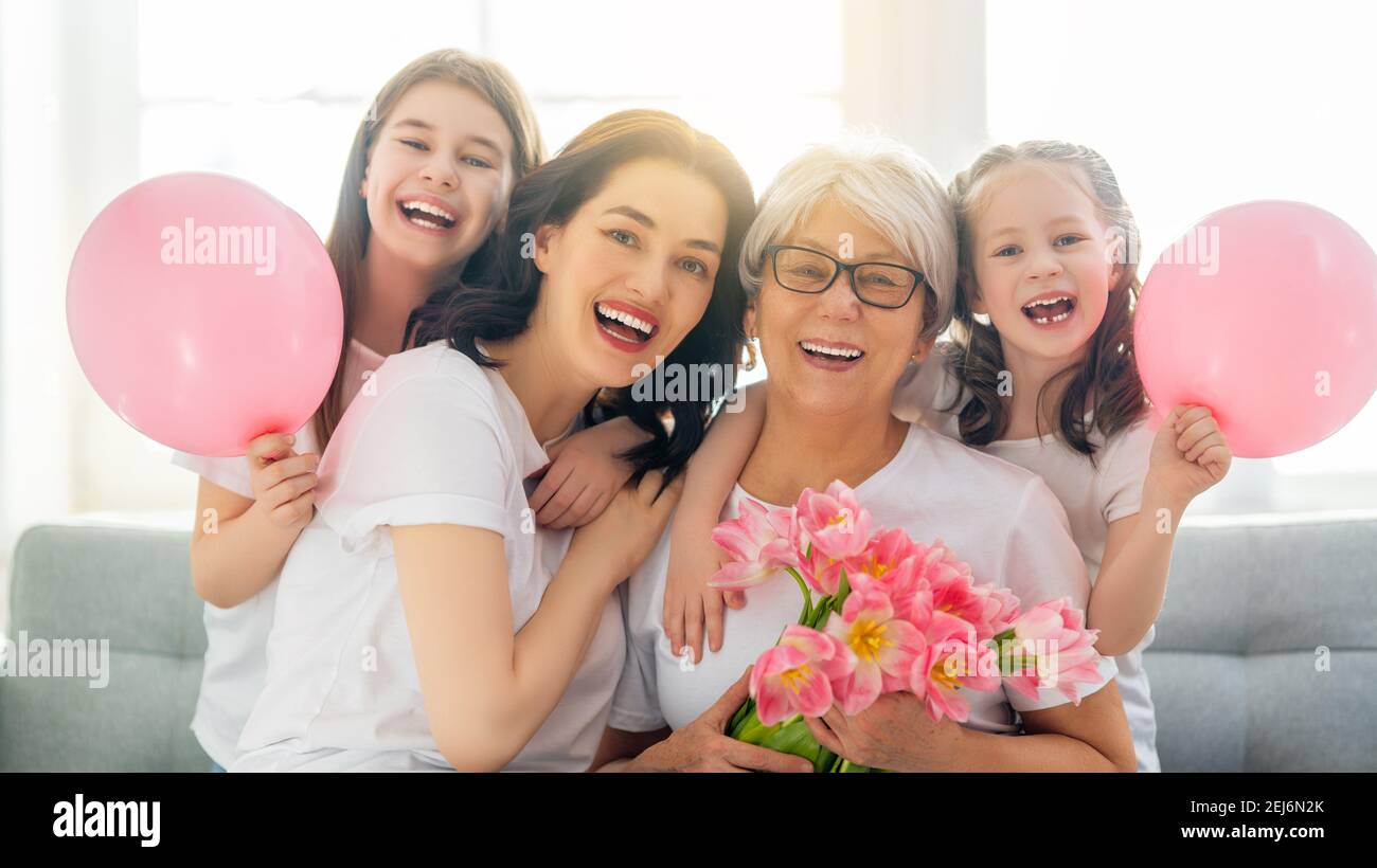 Happy women's day! Child daughters are congratulating mom and granny ...