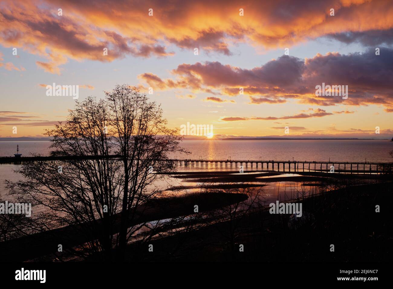 Spectacular sunset over White Rock's silhouetted pier and beach ...