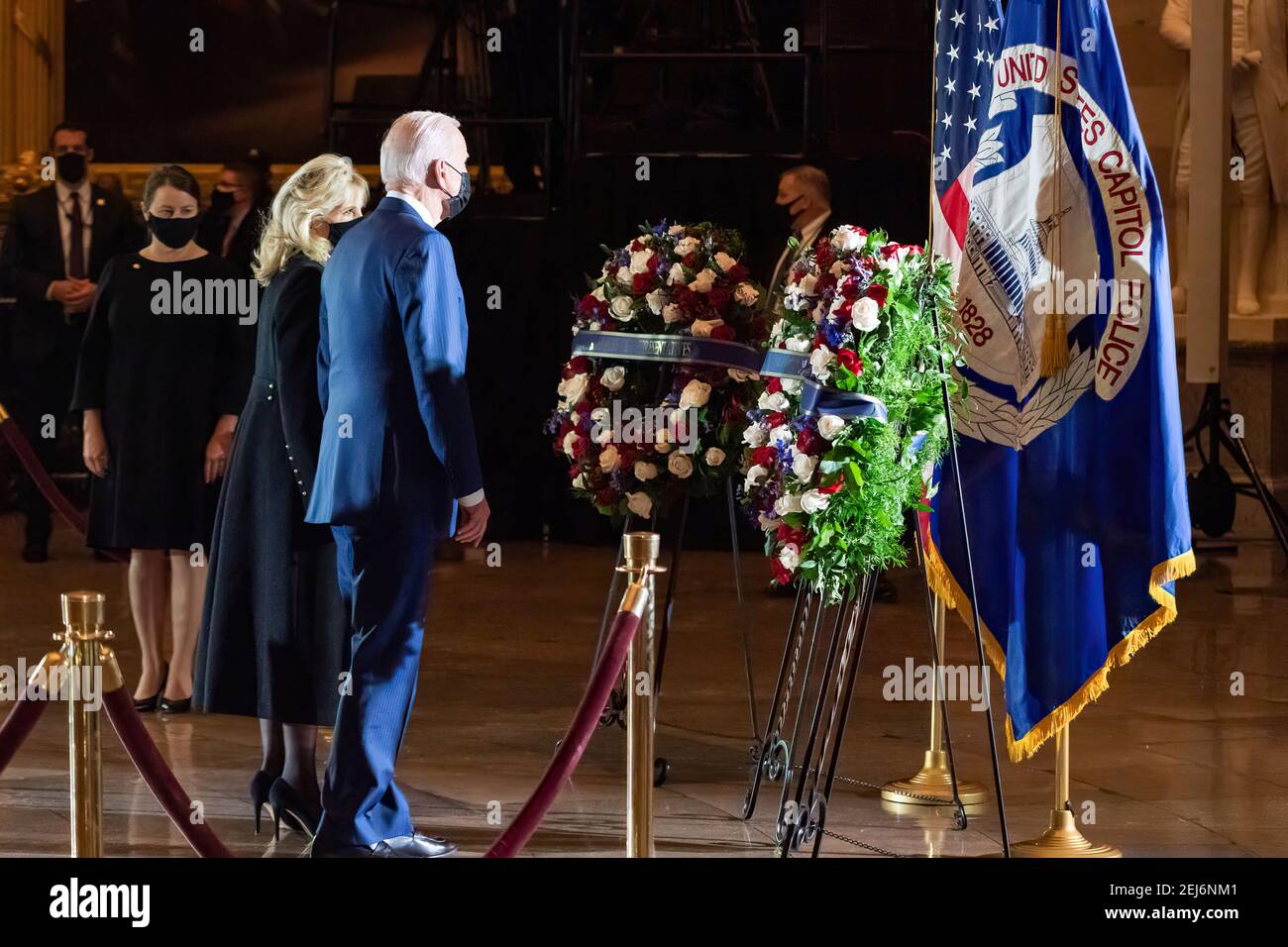 President Joe Biden and First Lady Dr. Jill Biden pay their respects to ...