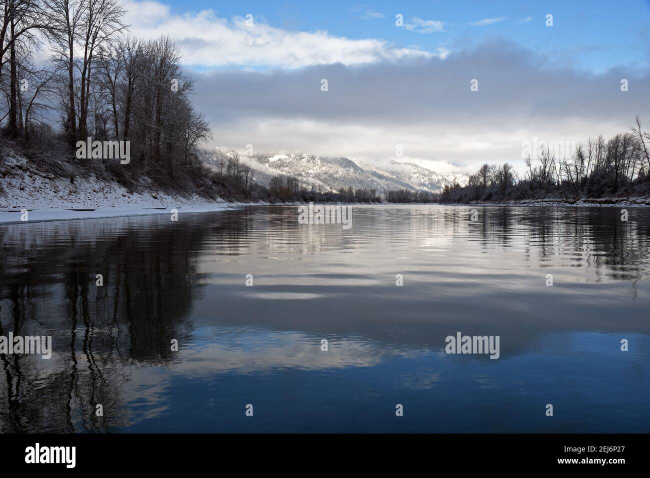 Kootenai River and the Selkirk Mountains at sunrise after a snowstorm ...