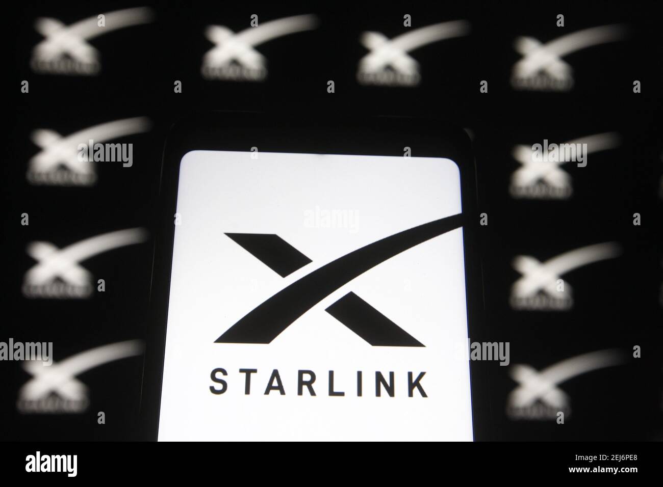In this photo illustration a Starlink logo of a satellite internet ...