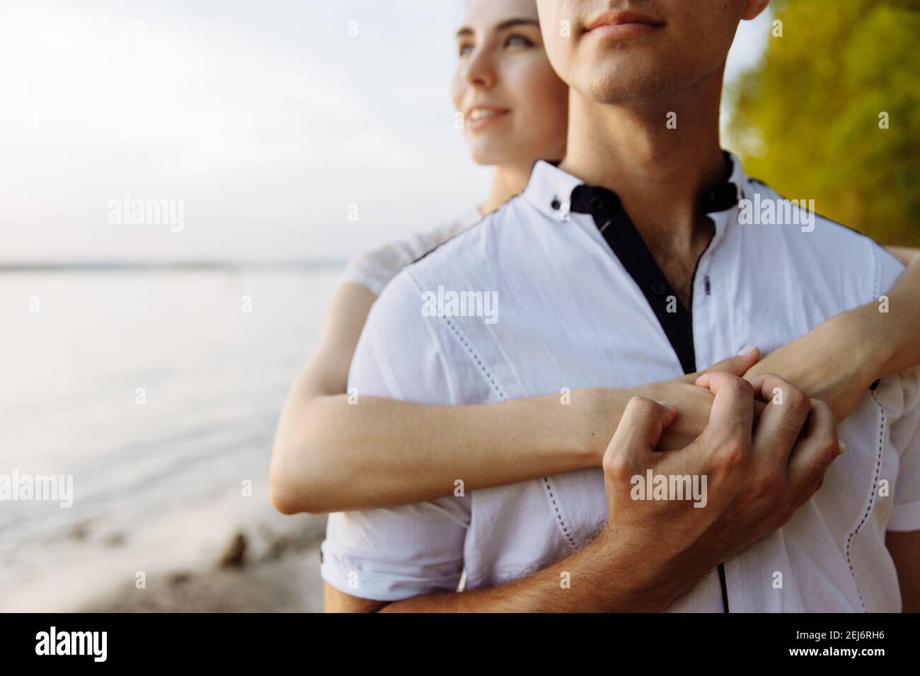 Female hands hug the man Stock Photo - Alamy