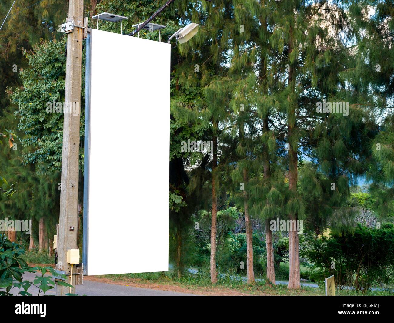 Empty white blank banner on electric pole for advertising beside the ...