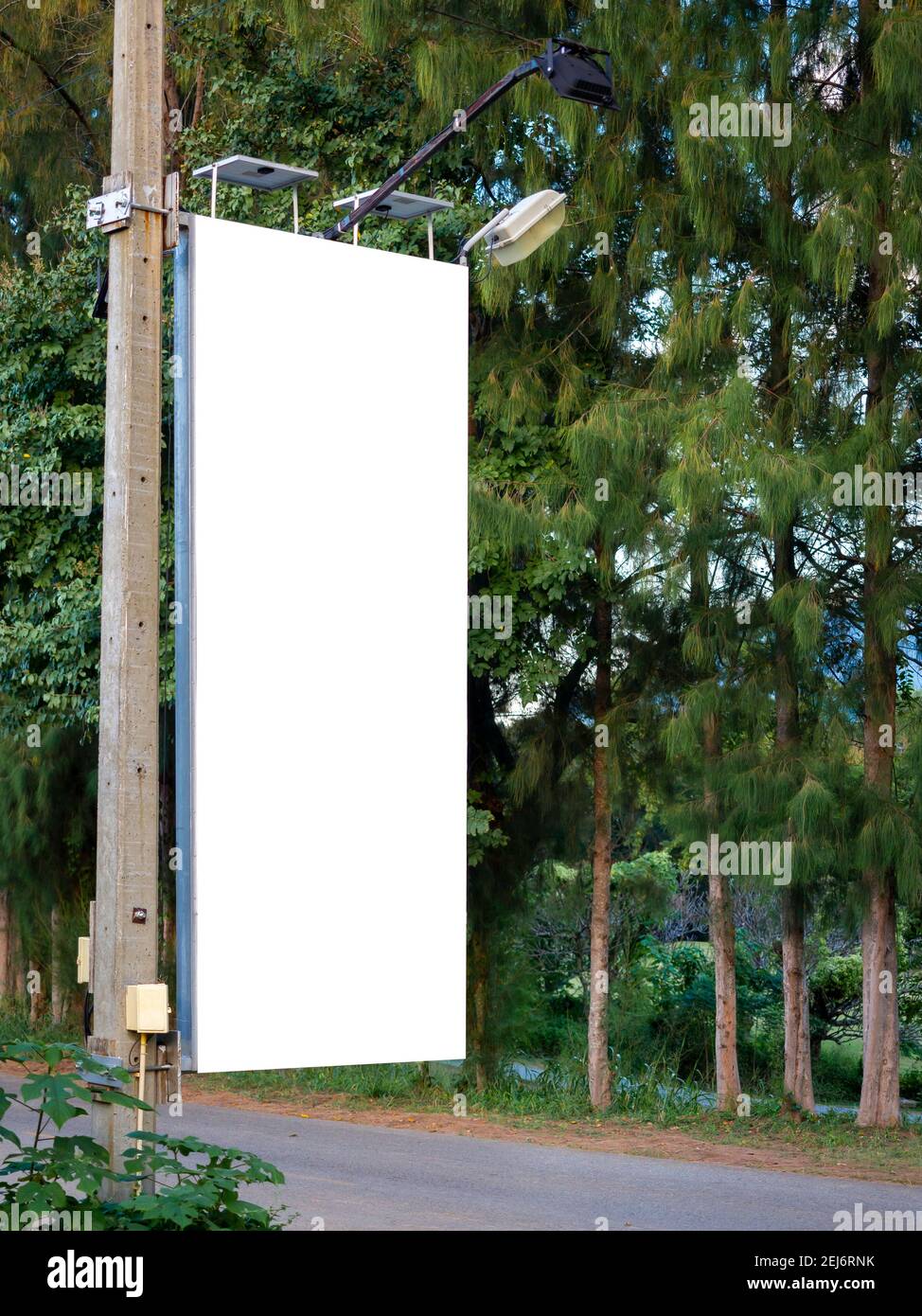 Empty white blank banner on electric pole for advertising beside the ...
