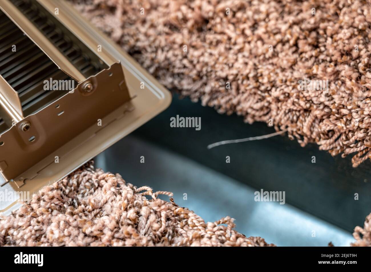 HVAC floor vent opened with carpet and piping visible Stock Photo - Alamy
