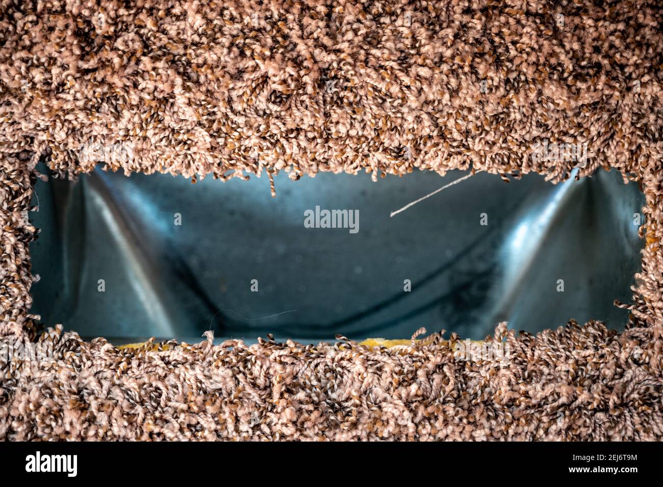 HVAC floor vent opened with carpet and piping visible Stock Photo - Alamy