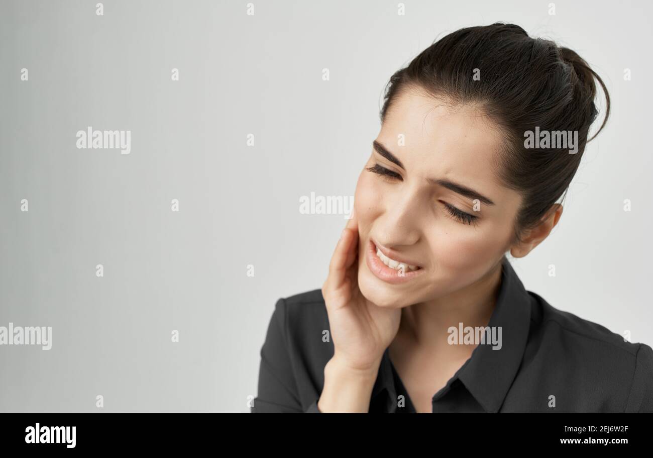 woman with displeased facial expression dental pain health problems ...