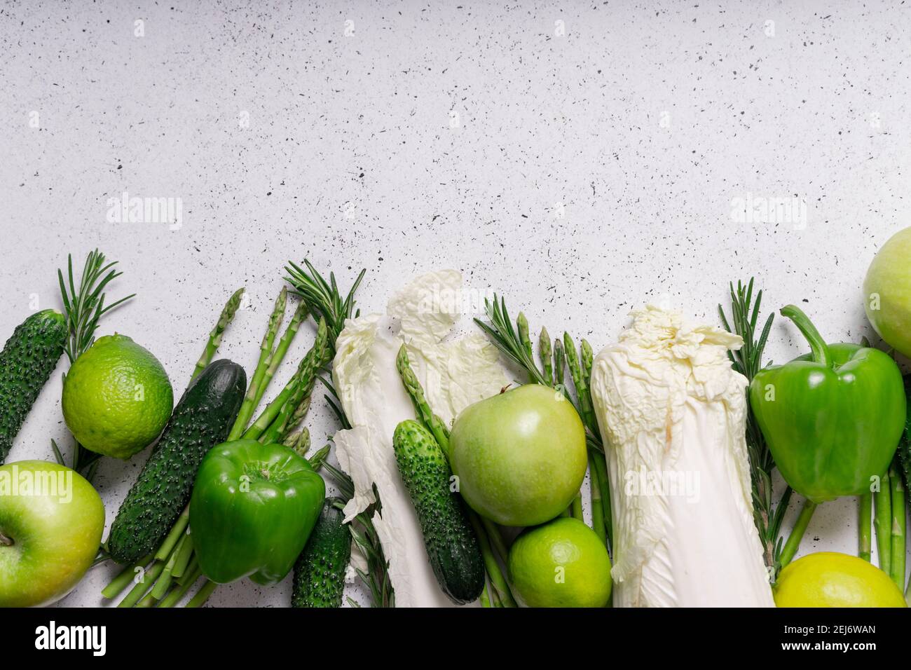 flatlay green organic food. on a light background with space for text ...