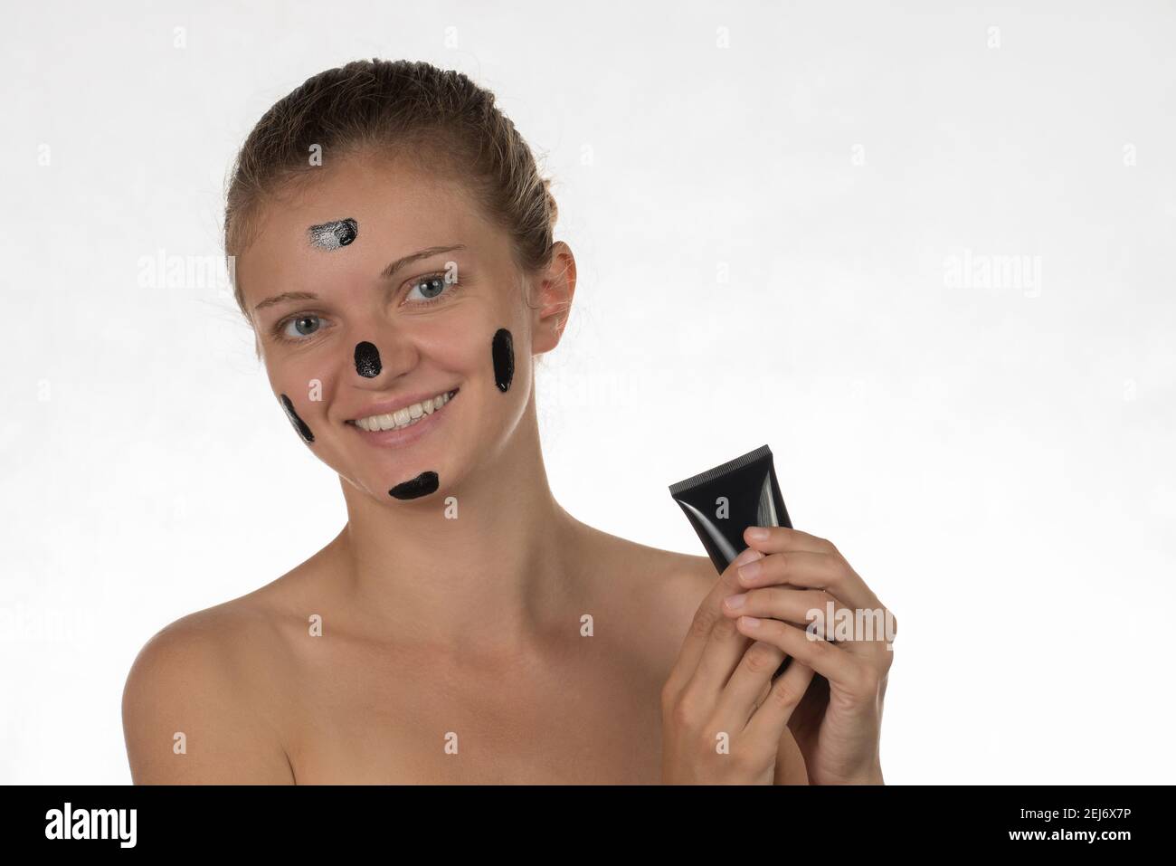 Happy beautiful girl with acne smiling on a white background in a ...