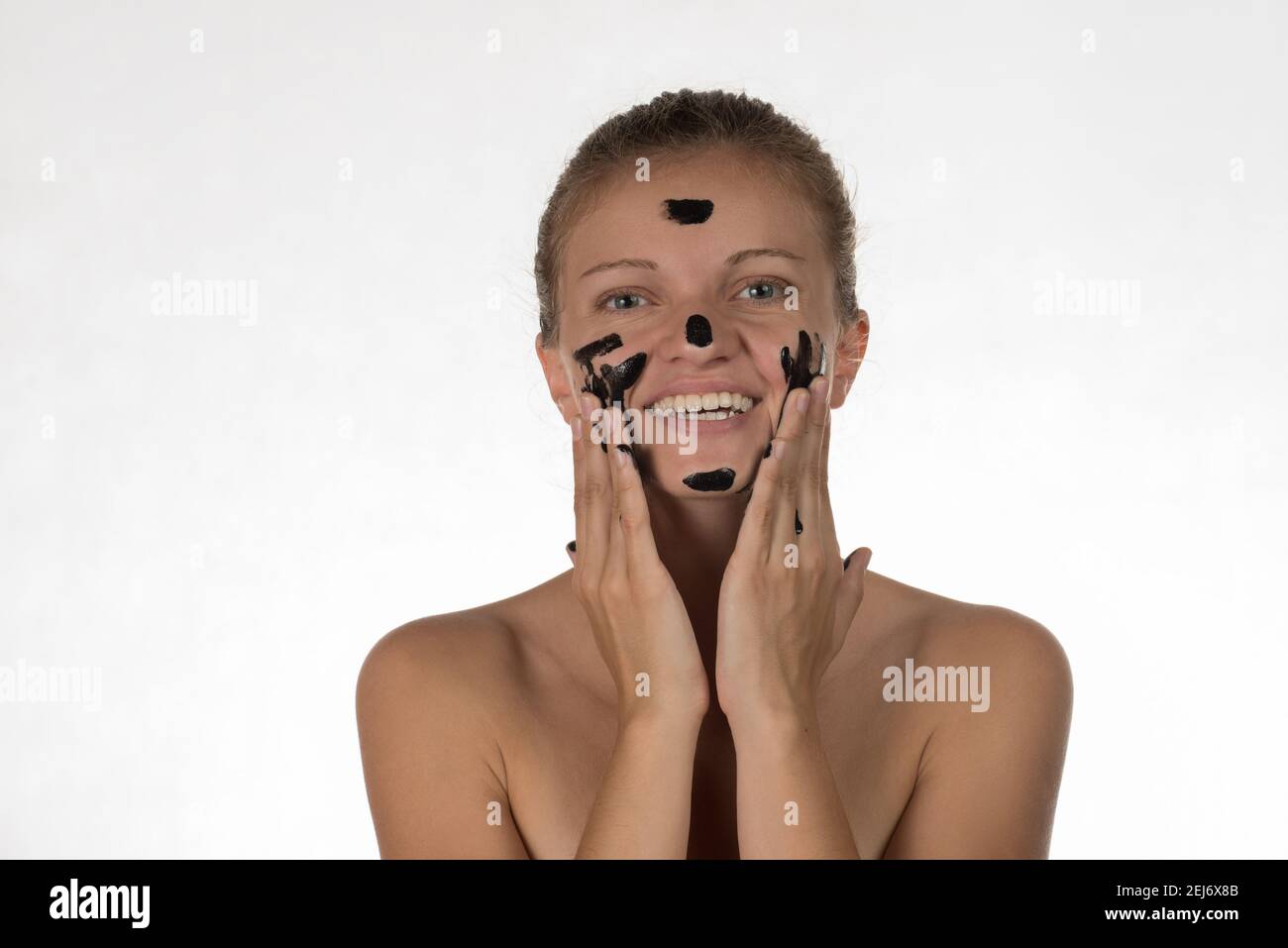 Happy beautiful girl with acne smiling on a white background in a ...