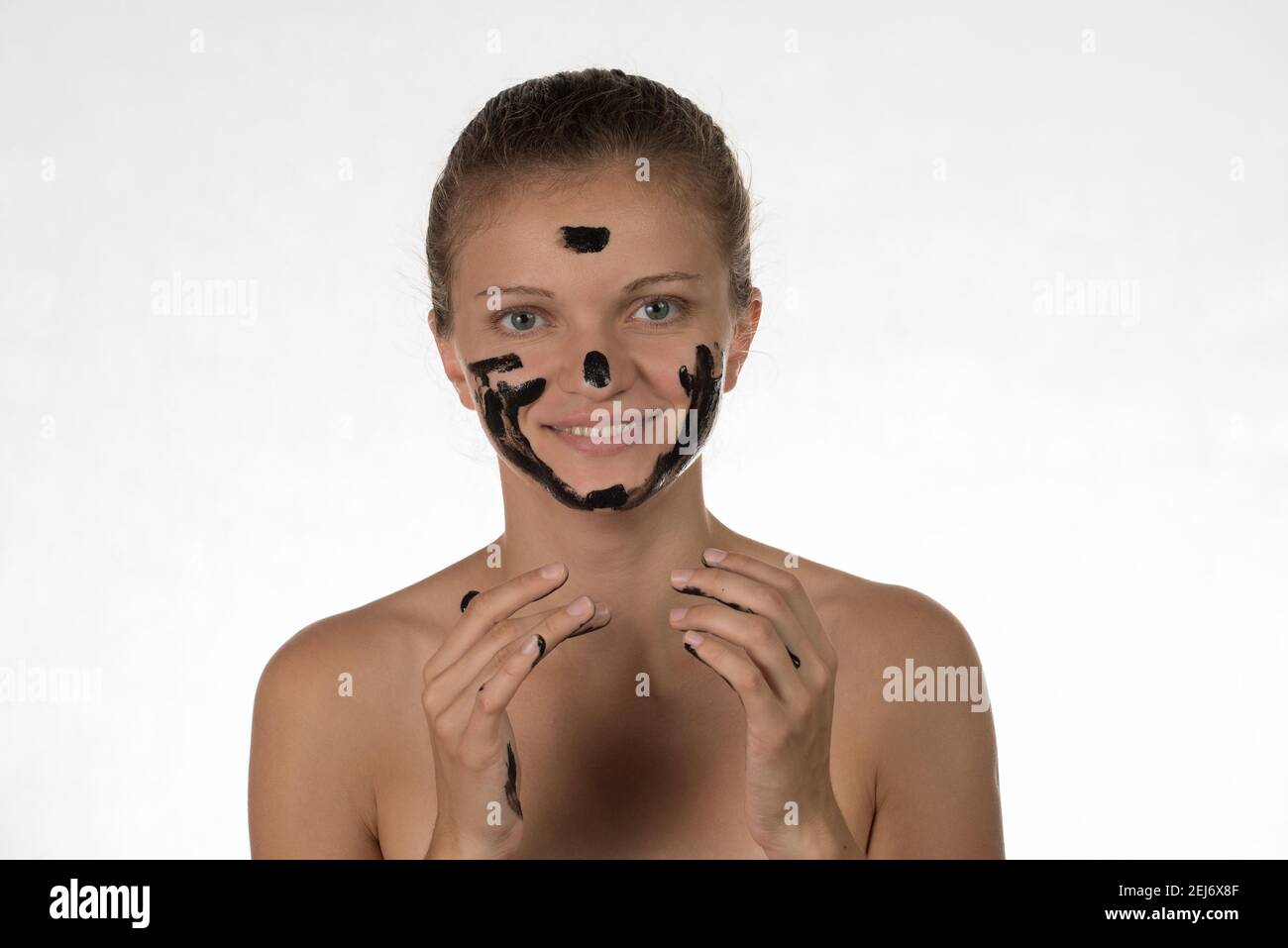 Happy beautiful girl with acne smiling on a white background in a ...