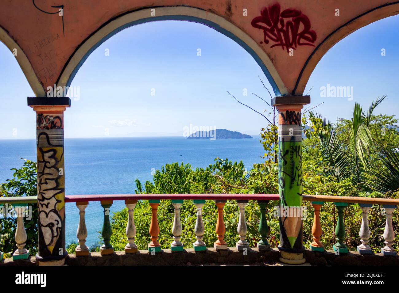 An abandoned graffiti covered structure provides a dramatic overlook of ...