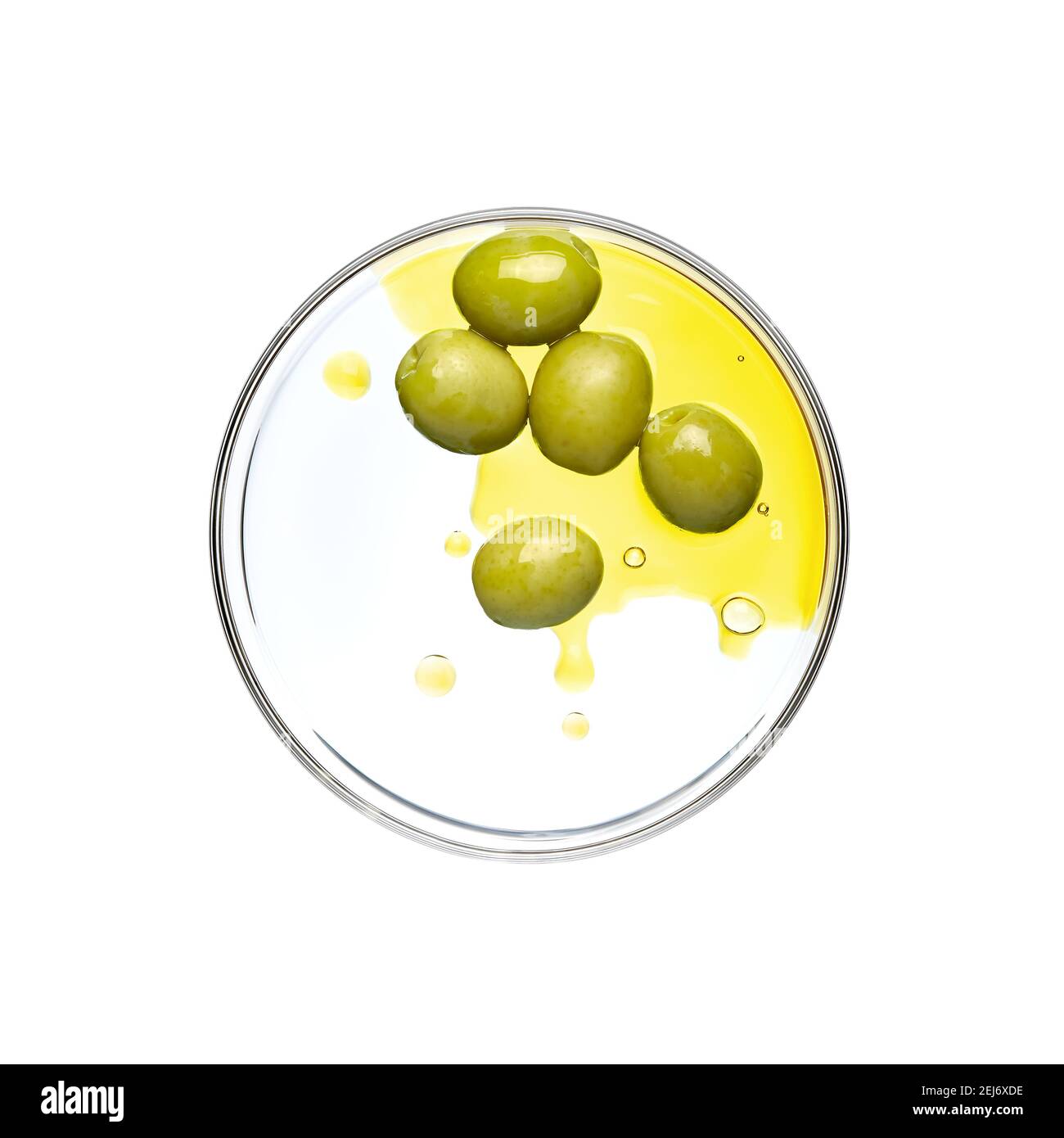Green olive and oil on petri dish over white background Stock Photo - Alamy