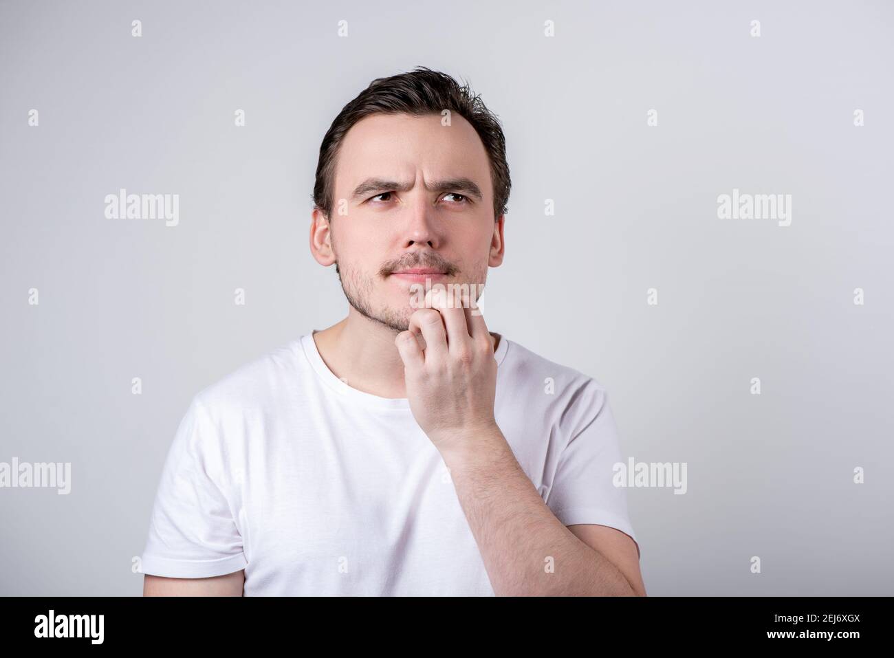 Handsome Brunette Guy With Bristles In A White T Shirt Makes Funny
