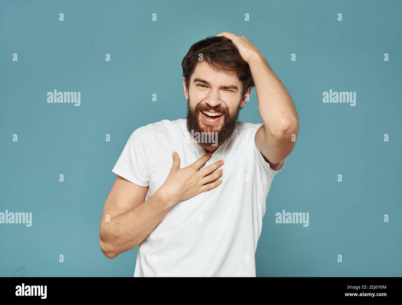 joyful man touching his head with his hands happiness emotions blue ...