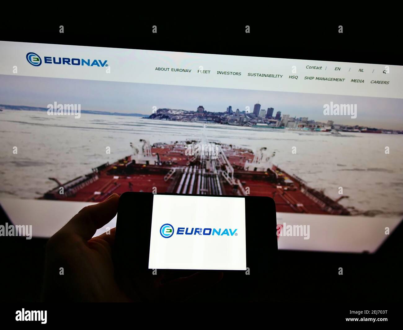 Person holding smartphone with logo of Belgian shipping company Euronav ...