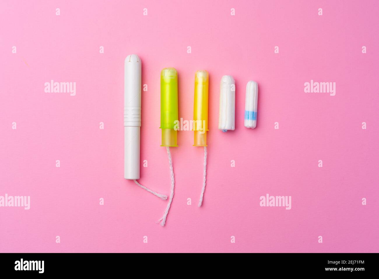Hygienic female tampon on a pink background Stock Photo - Alamy