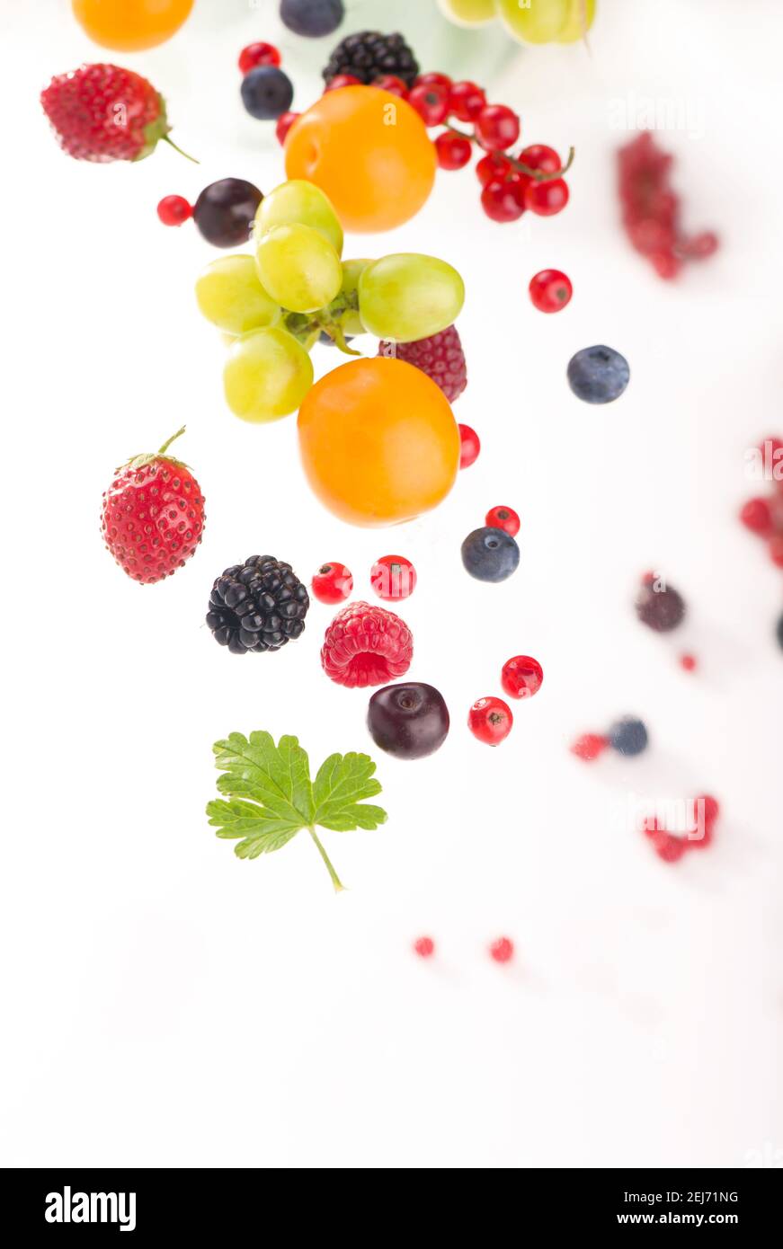 berry mix isolated on a white background Stock Photo - Alamy