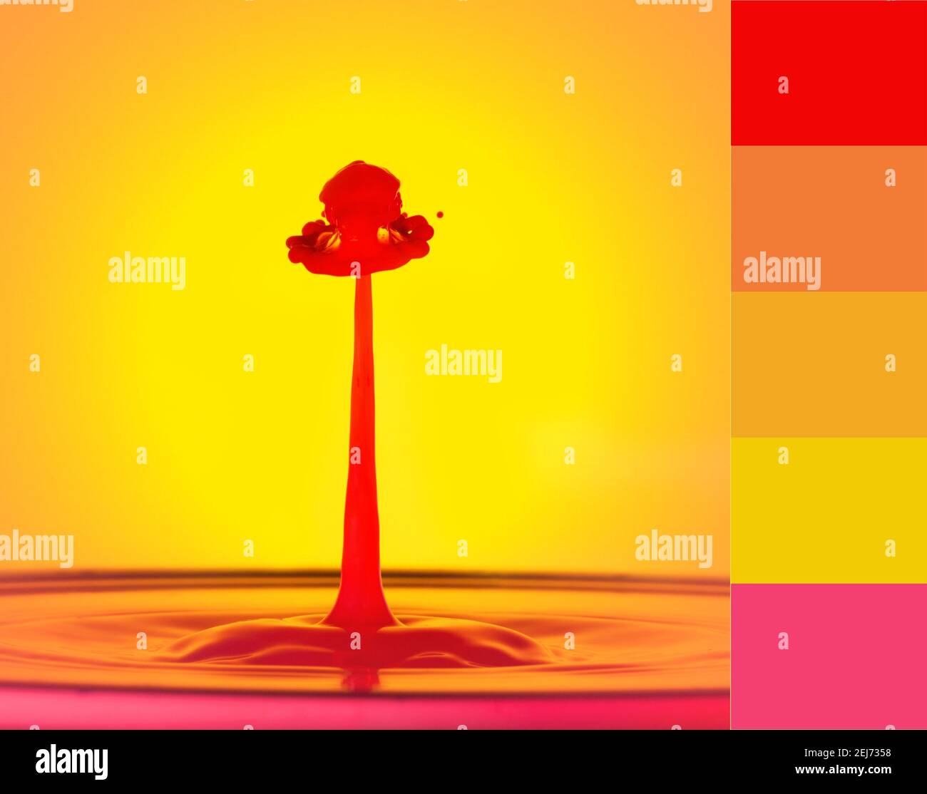 A red water drop spout with a decorated hat shape on top, against a ...