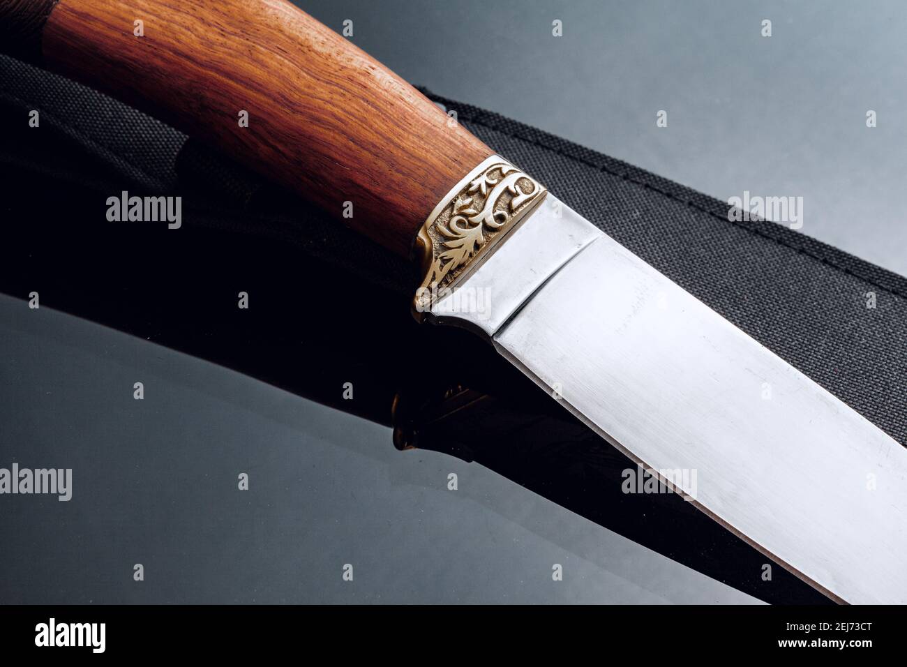 Hunting knife on black background with reflection Stock Photo - Alamy
