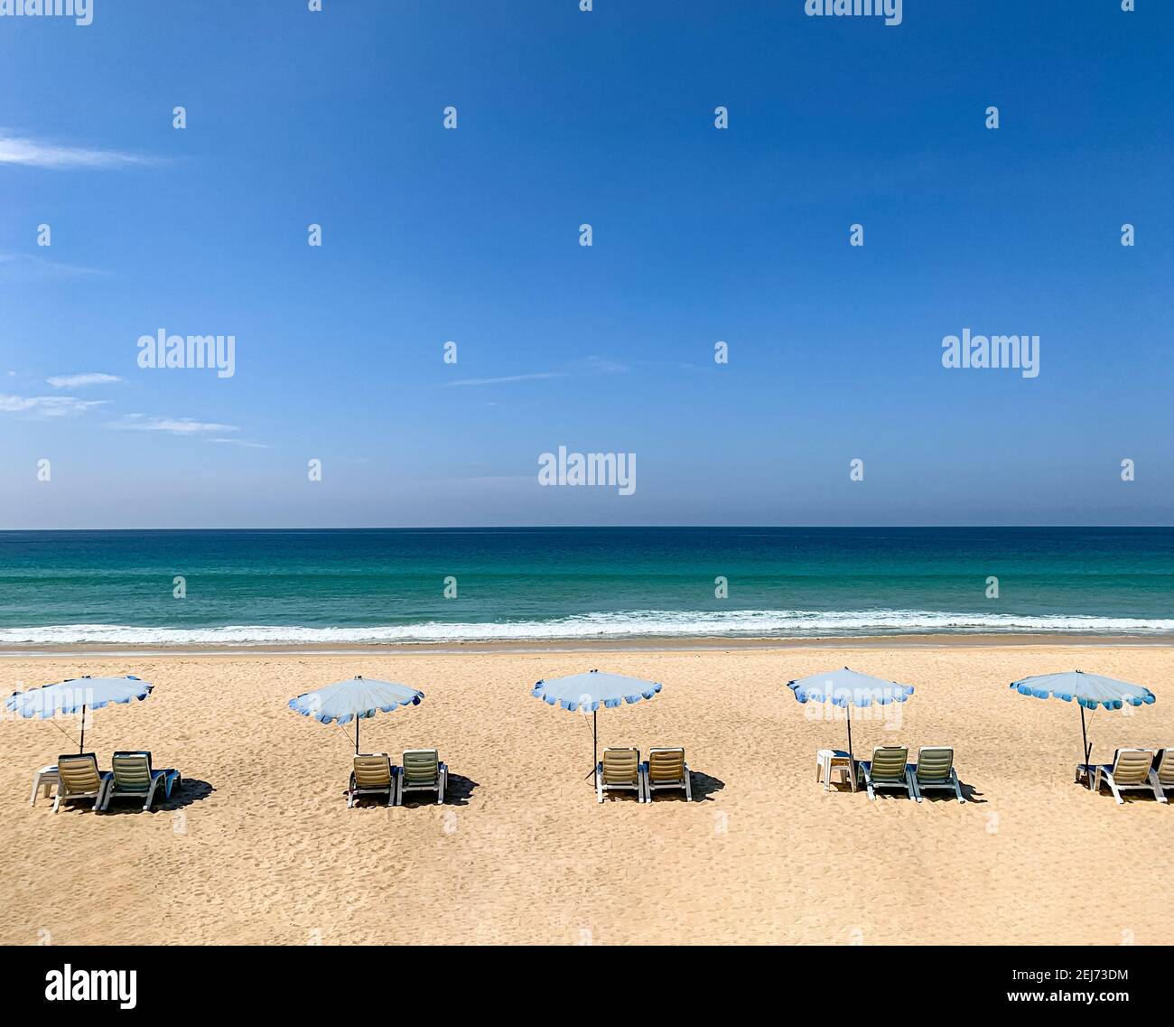 Beach beds at clear empty beach Stock Photo - Alamy