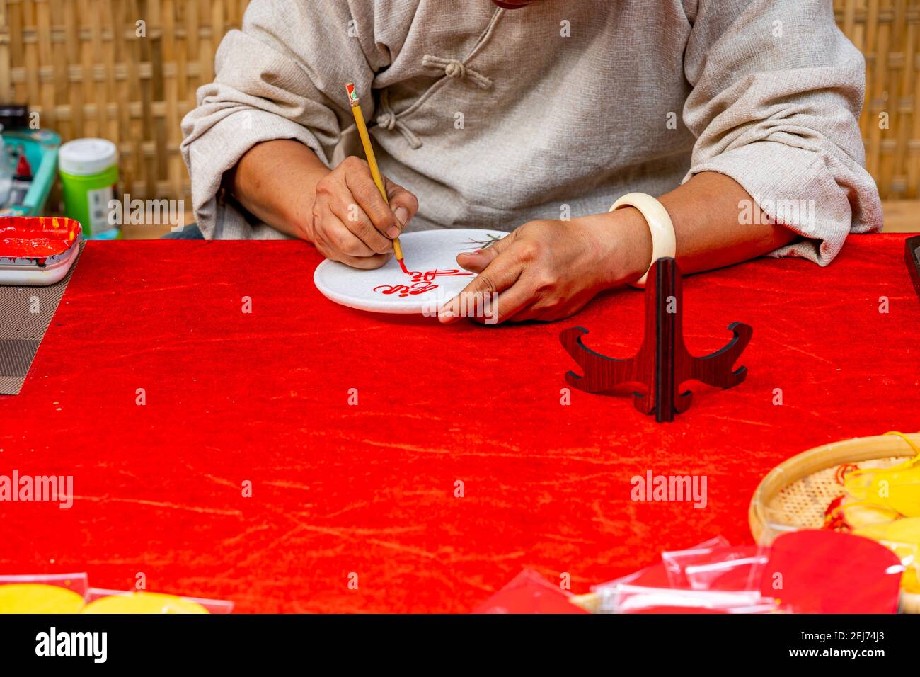 Human using brush pen and writing traditional calligraphy in Tet ...