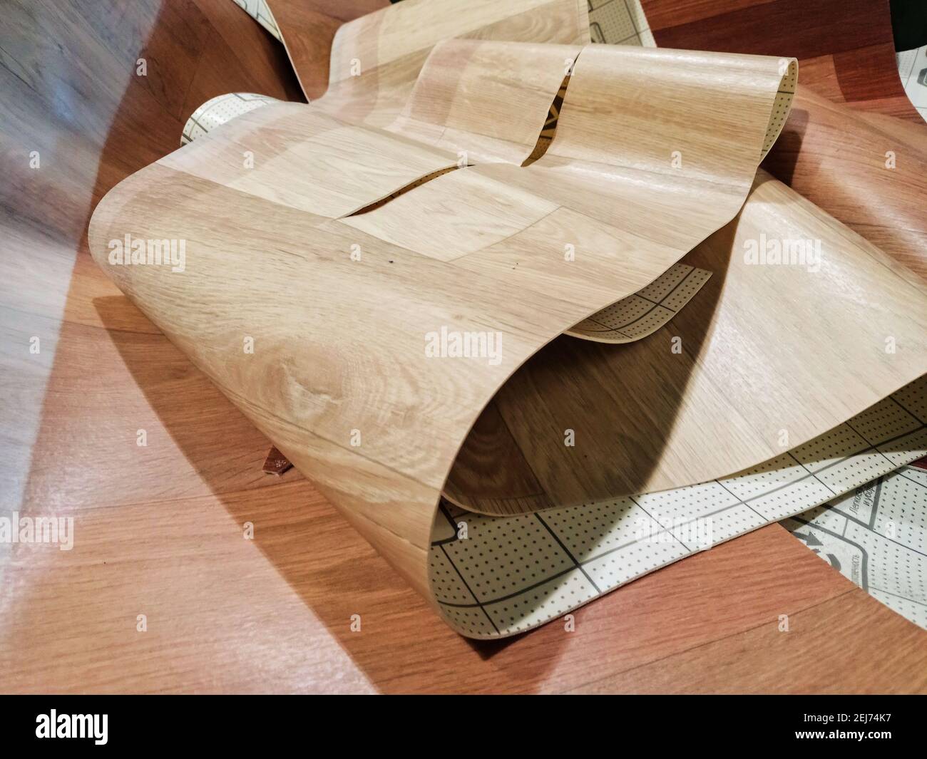 A pile of remnants of pieces of linoleum stacked on top of each other ...